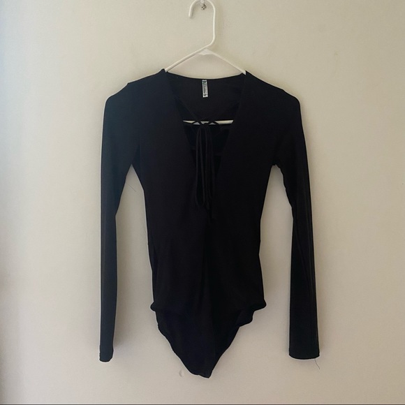 Tops | Black Lace Up Cross Bodysuit | Poshmark